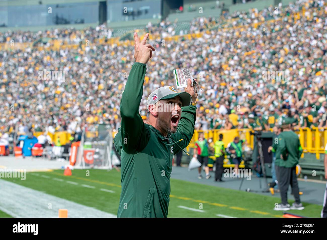 Green Bay Packers head coach Matt LaFleur celebrates as he leaves the ...