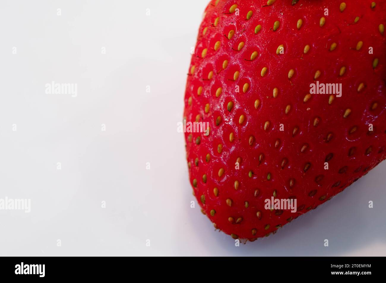 Close view of strawberry with tiny thread and moist skin Stock Photo ...