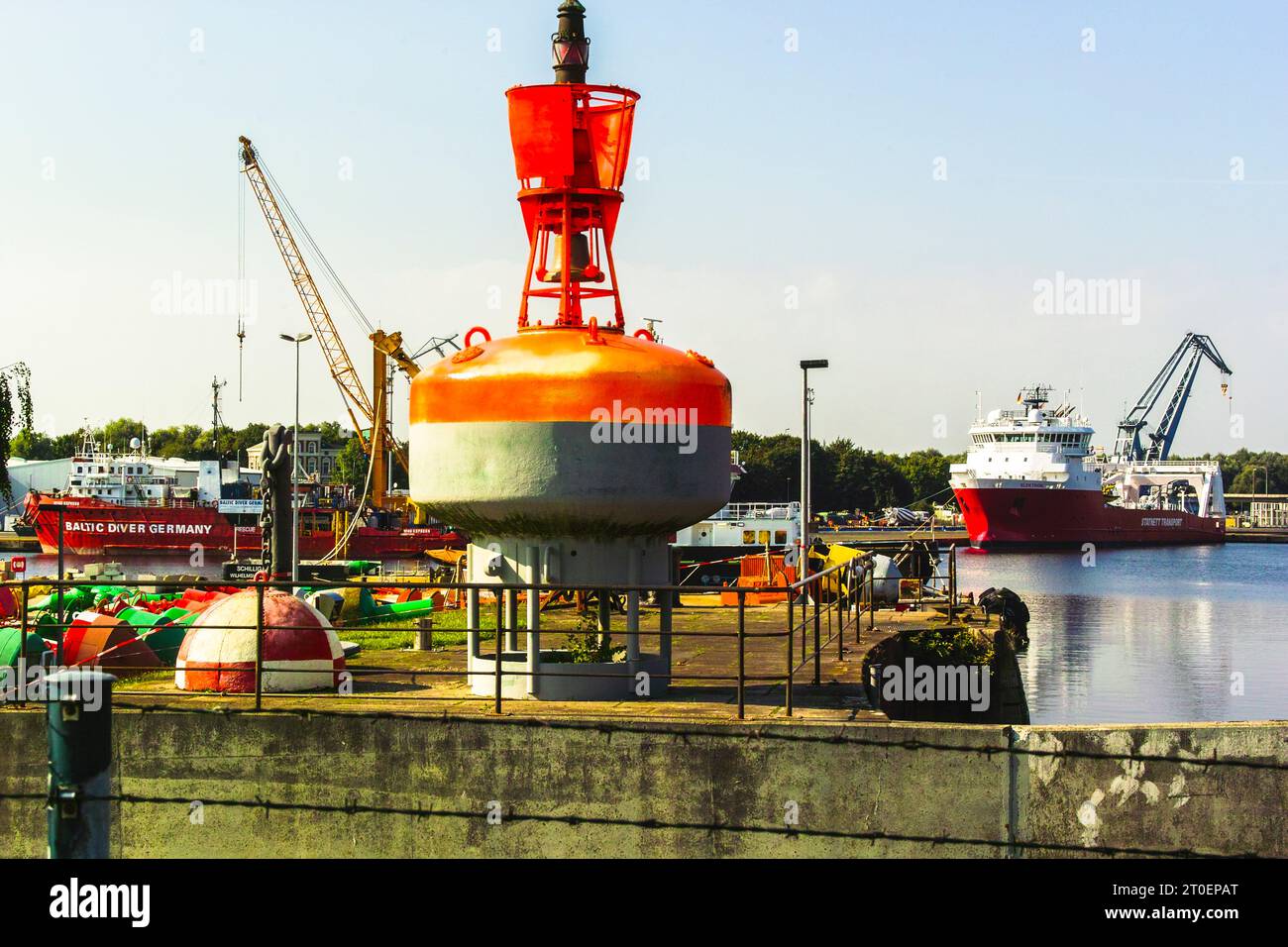 barrel yard with sea mark and harbor basin with ocean-going ships in ...