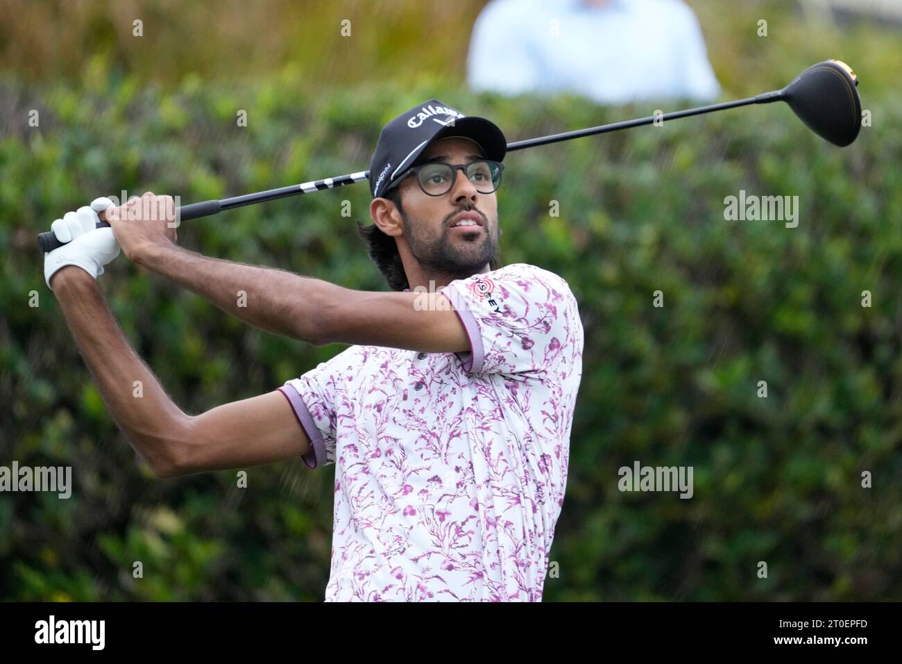 Akshay Bhatia watches his drive off the first tee during the second day ...