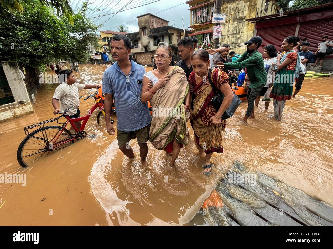October 6, 2023: People cross a waterlogged road after heavy rainfall ...
