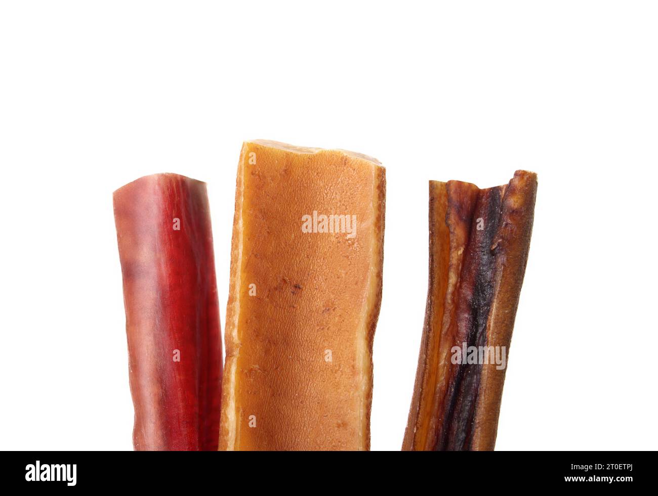 Variety of dog chew sticks. Close up of beef bully stick, yak milk bone ...