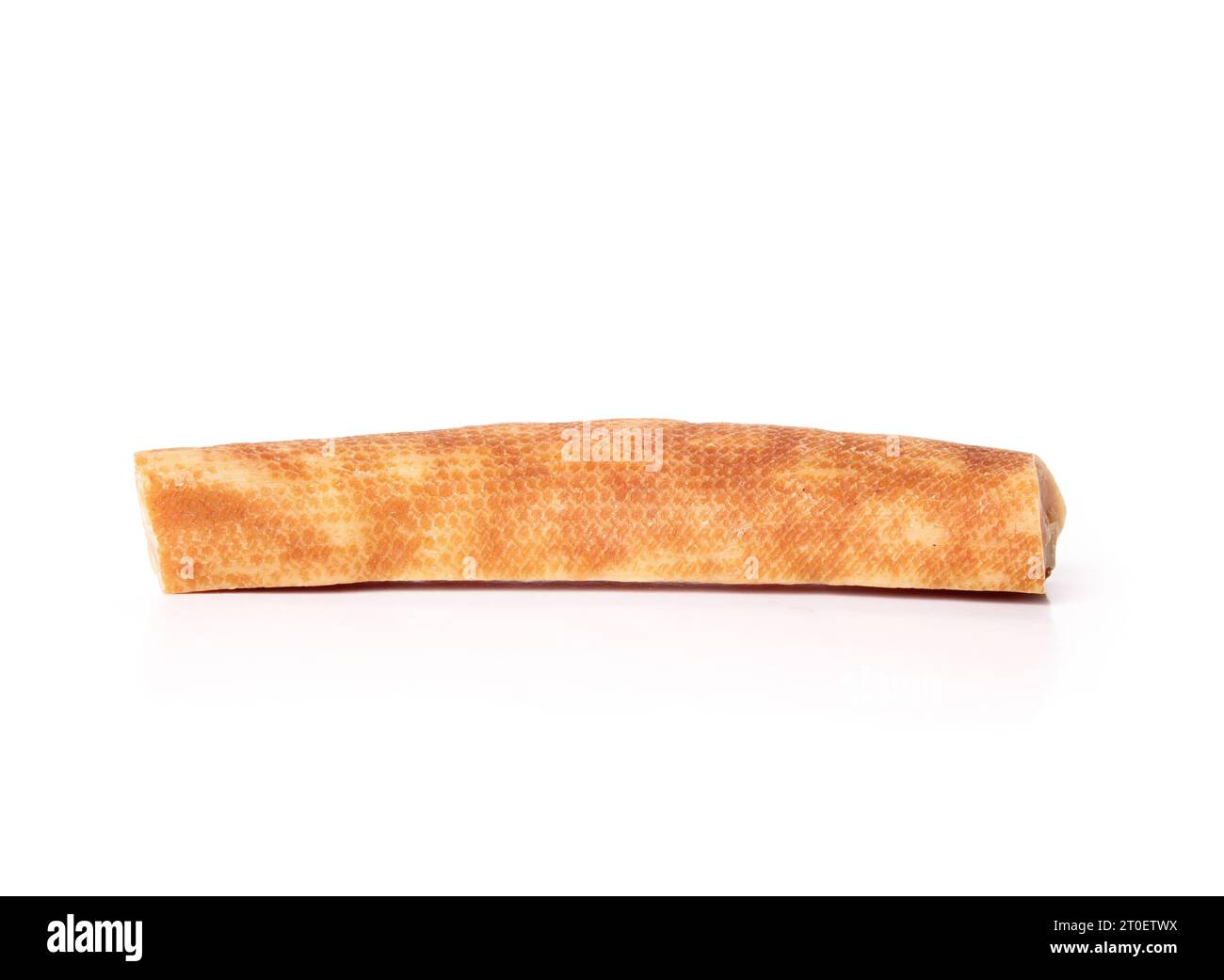 Isolated Yak cheese dog chew bone. Sideview of yellow orange dog chew ...
