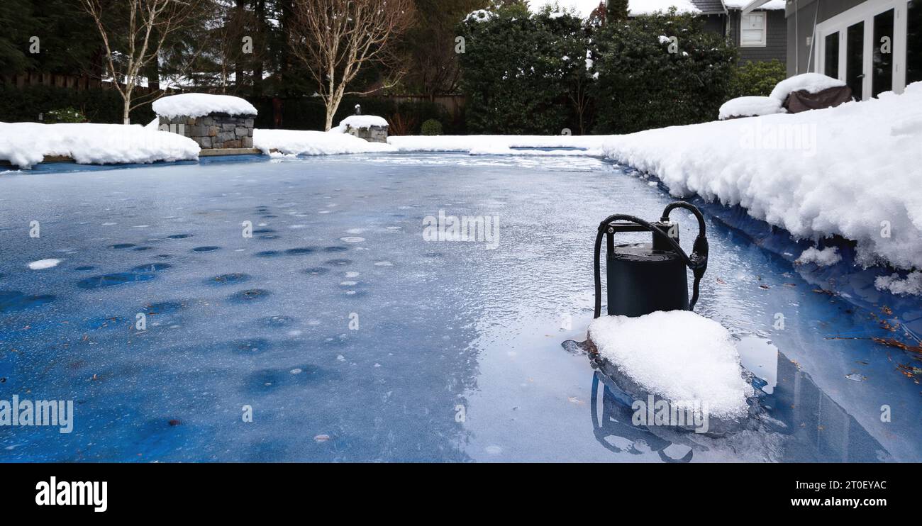 Automatic pool pump in ice and slush after snow storm. Inground ...