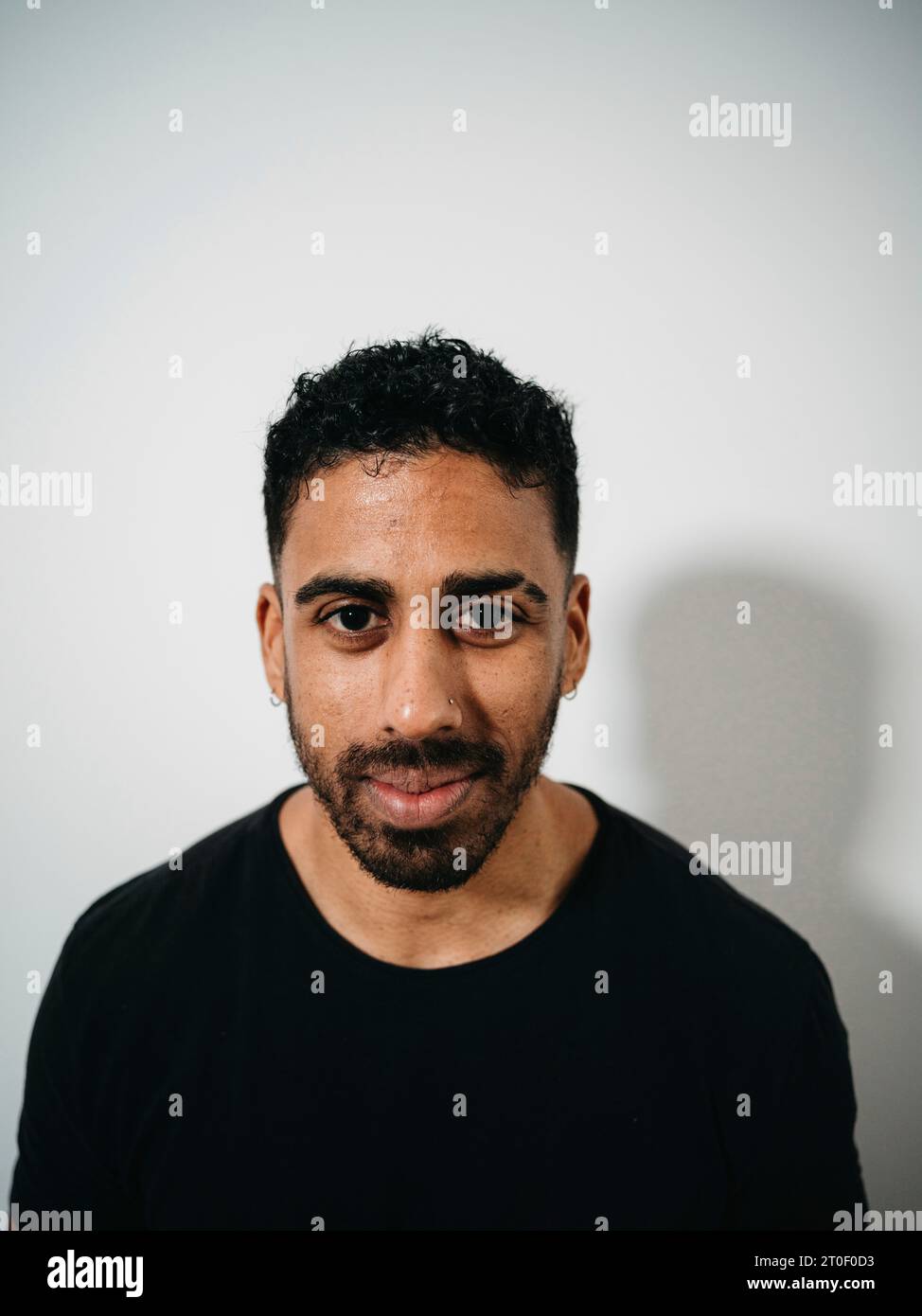 Non-binary man with black t-shirt Stock Photo - Alamy