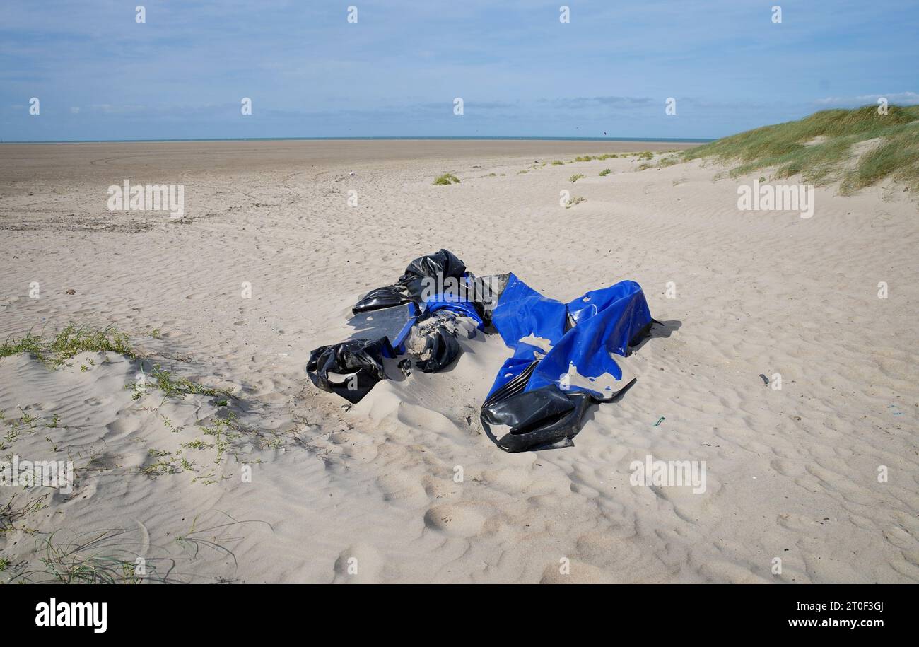 A view of a small inflatable boat left on the beach in Gravelines ...