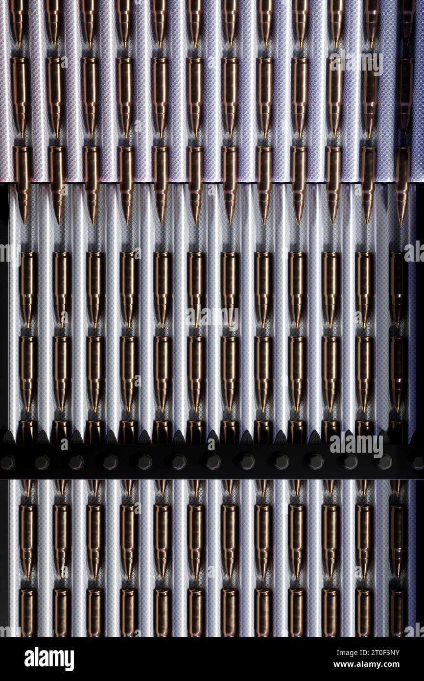 A production line at an ammo factory with freshly manufactured bullets ...