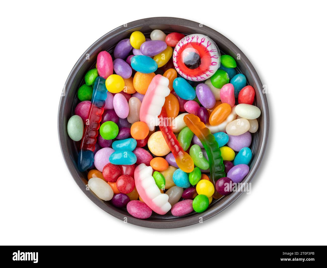 Assorted colorful candies on a bowl isolated over white background ...