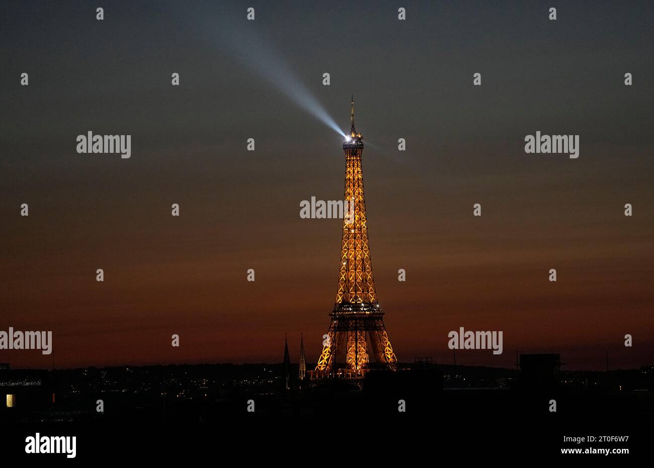 The Eiffel Tower is illuminated during sunset in Paris, Friday, Oct. 6 ...