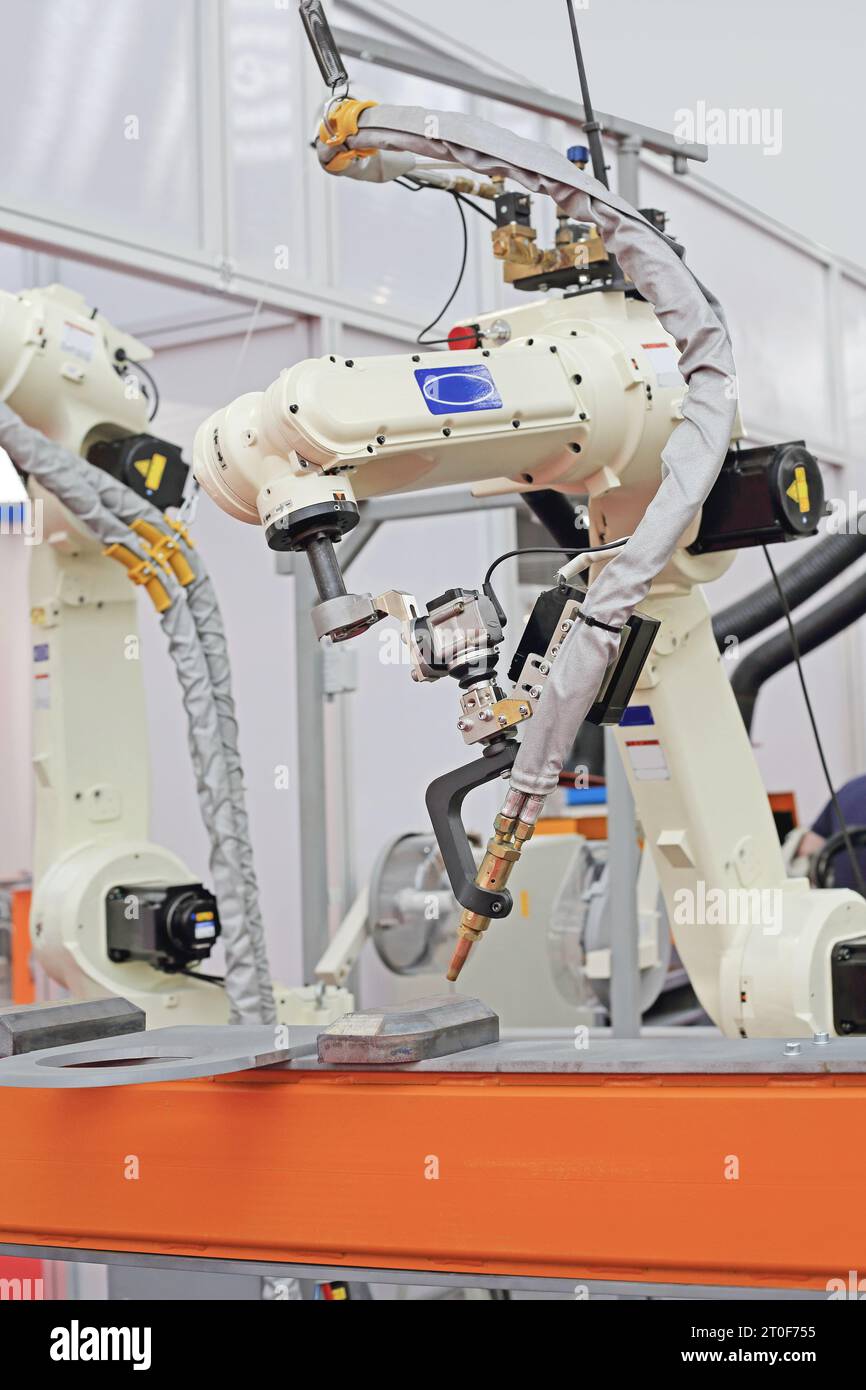 Two Automated Robotic Arms Welding in Metal Factory Production Stock ...