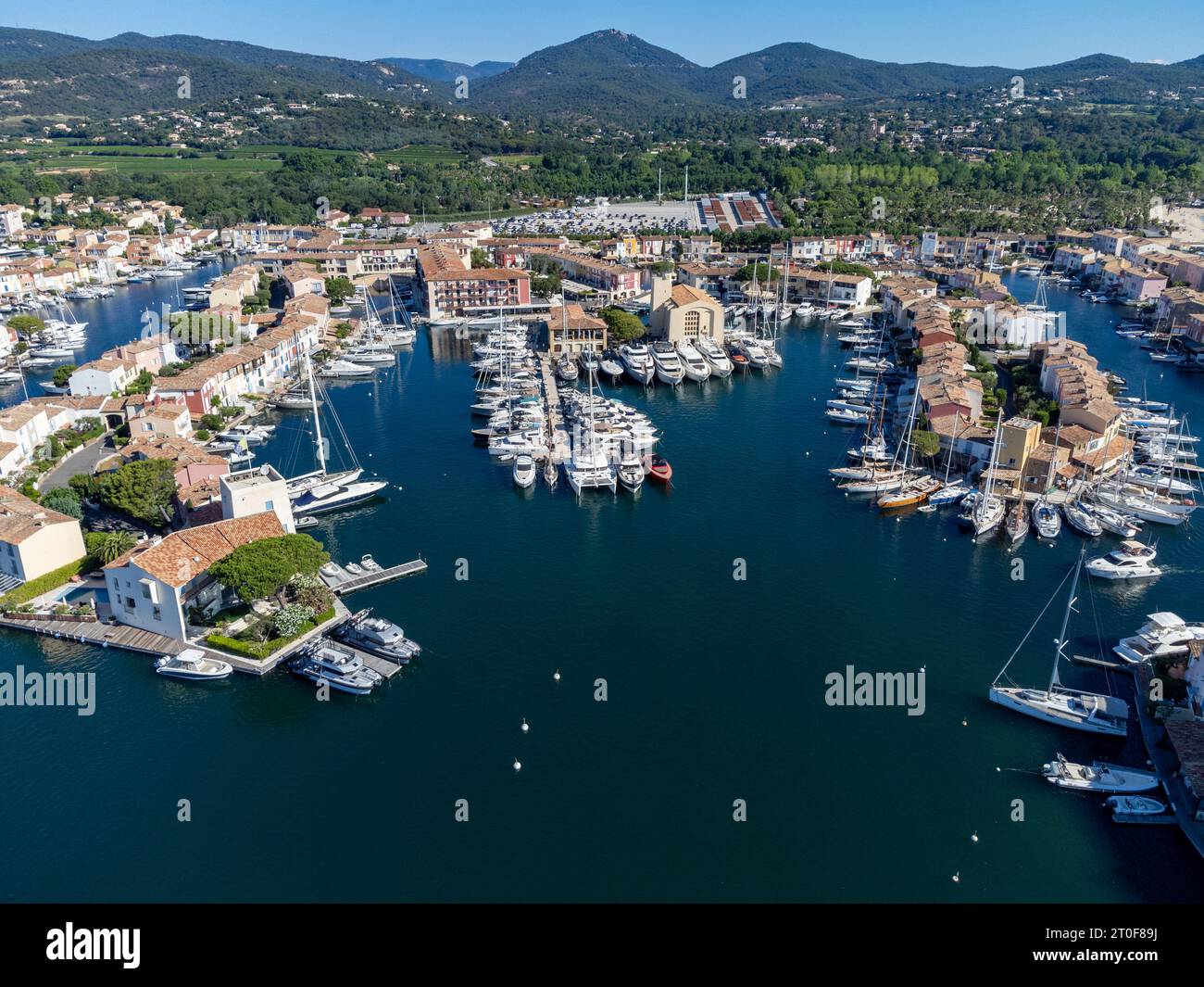 Arial view on blue water of Gulf of Saint-Tropez, boats, houses in Port ...