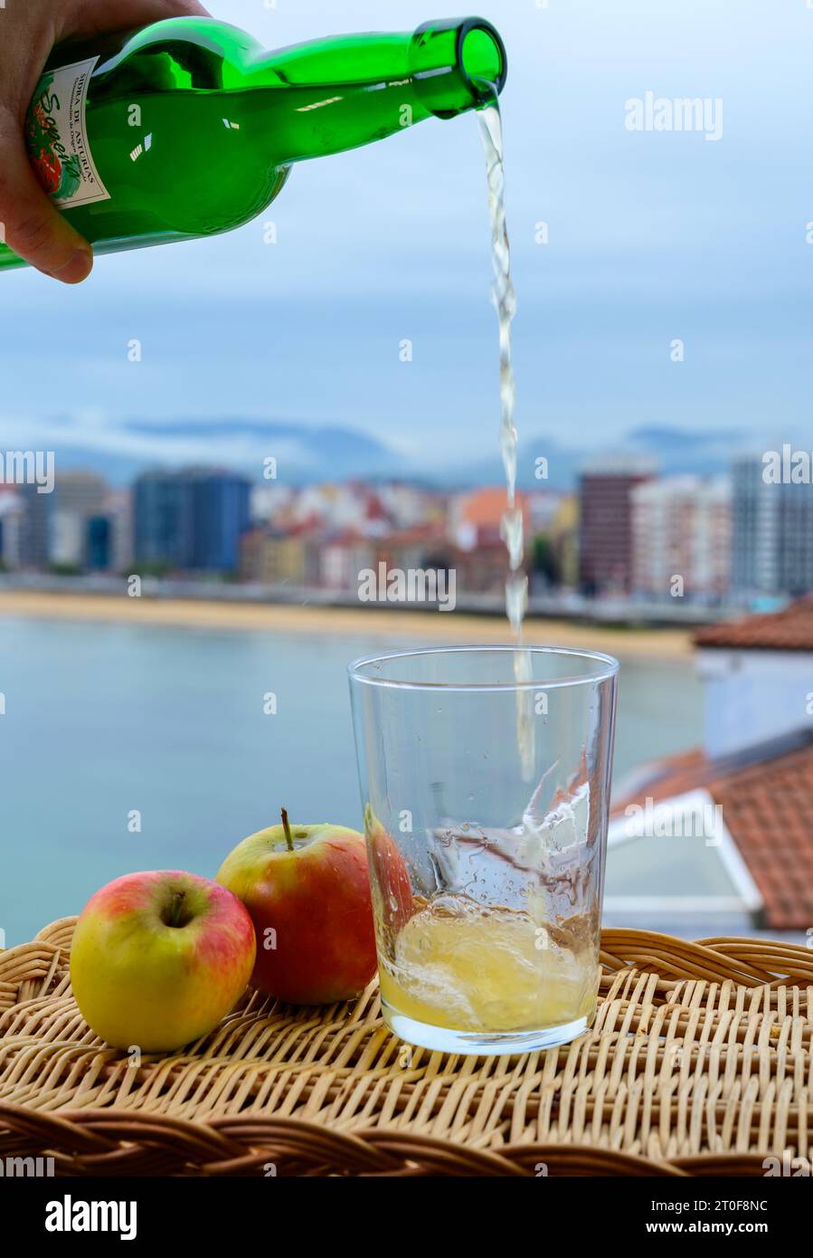 Traditional natural Asturian cider made from fermented apples in wooden ...