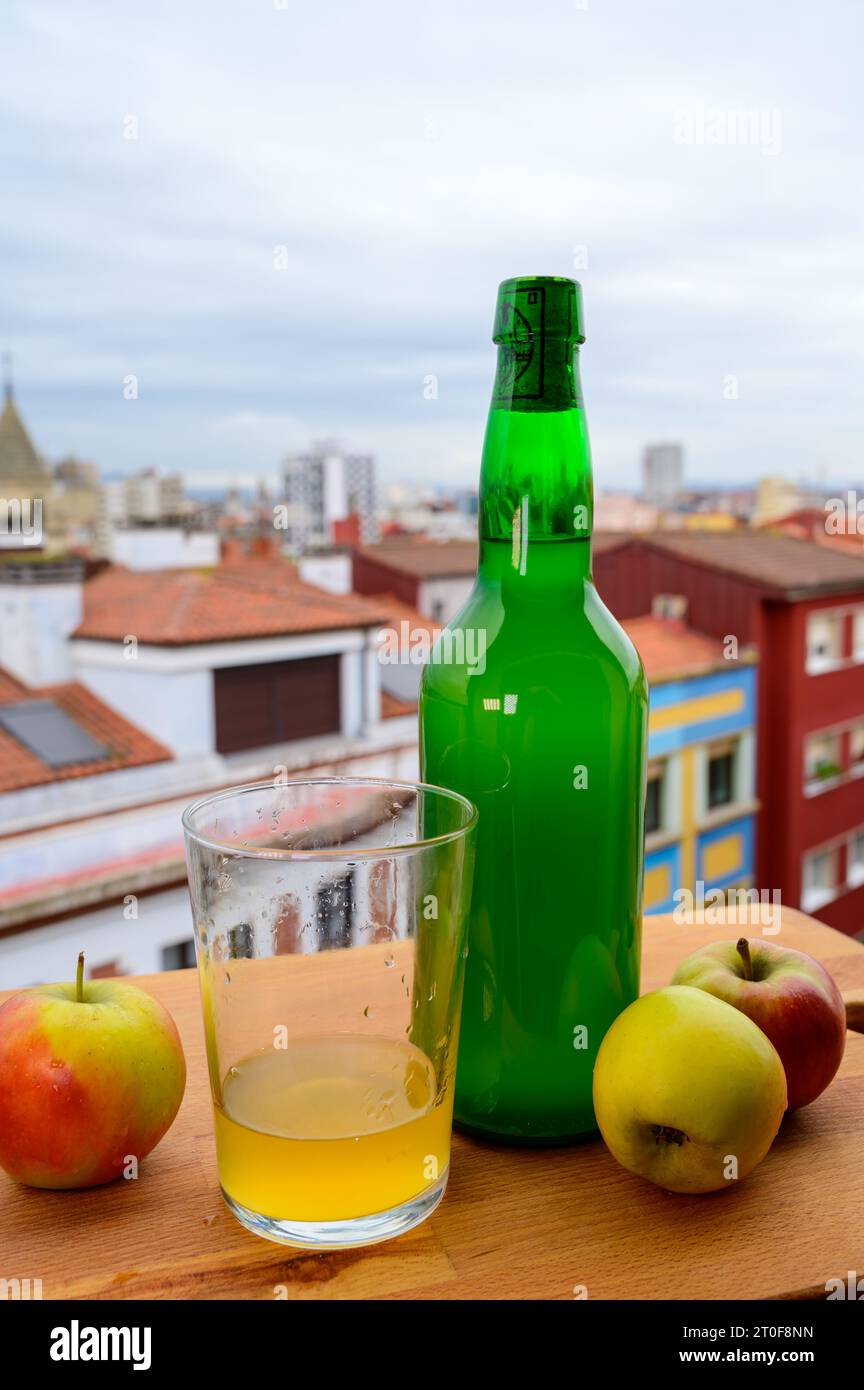 Traditional natural Asturian cider made from fermented apples in wooden ...