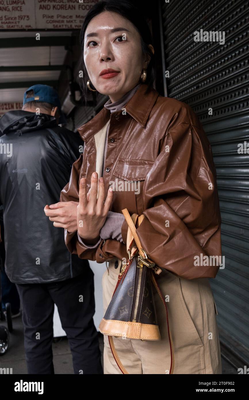 Seattle, USA. 28th Sep, 2023. A woman holding a Louis Vuitton bag in ...