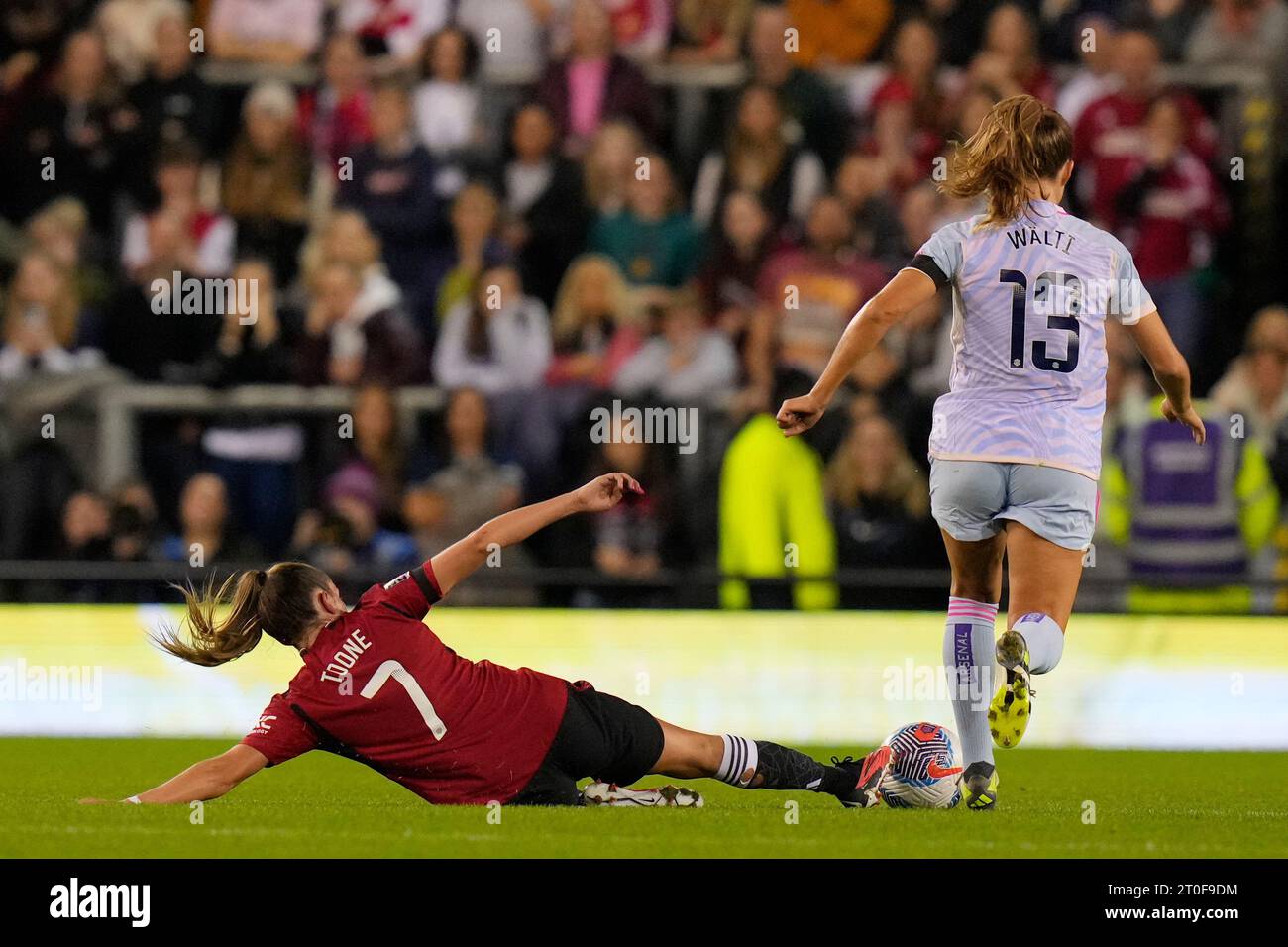 Ella Toone #7 of Manchester United slides in to tackle Lia Wälti #13 of ...