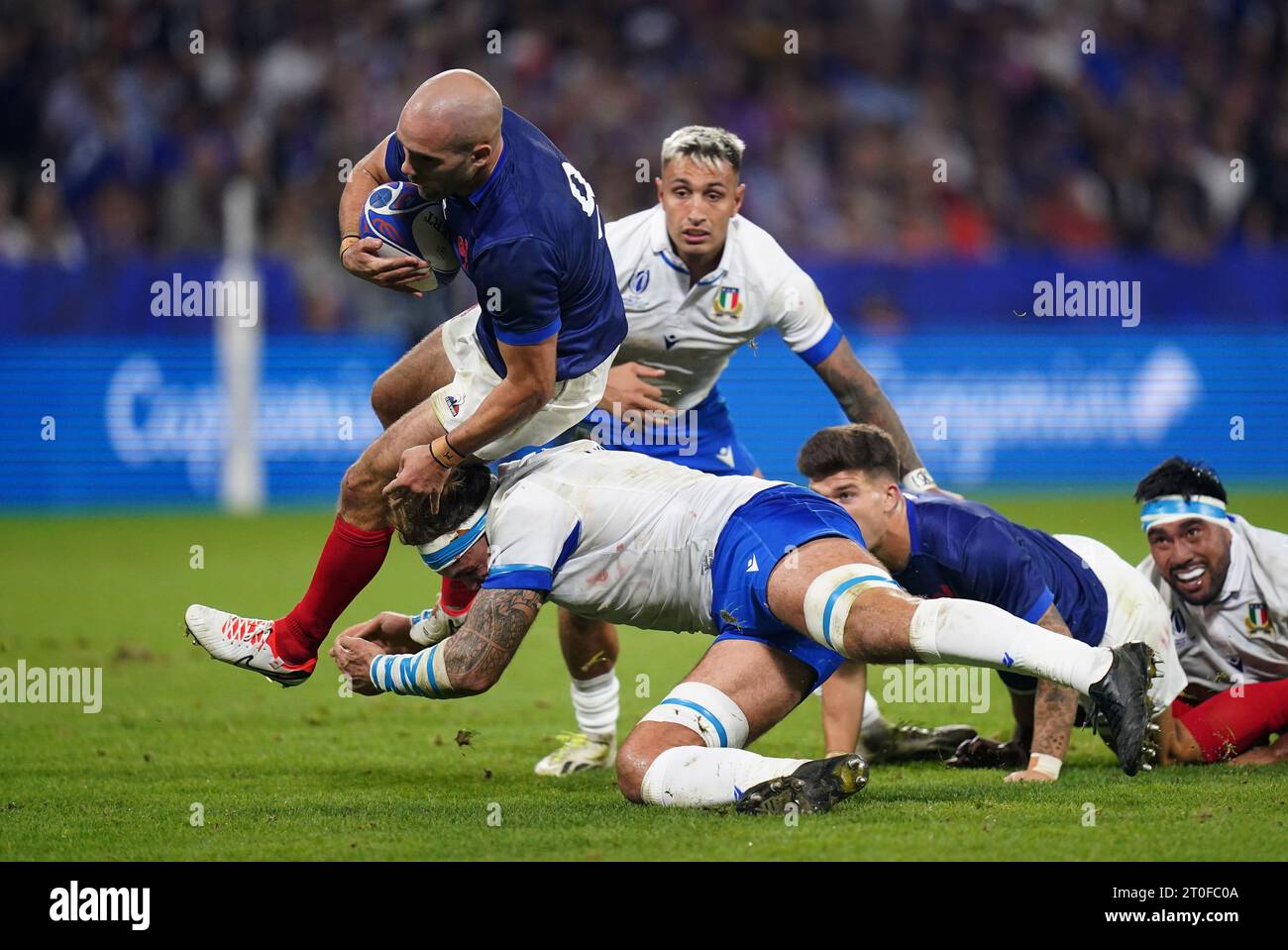 France's Maxime Lucu is tackled by Italy's Niccolo Cannone during the ...