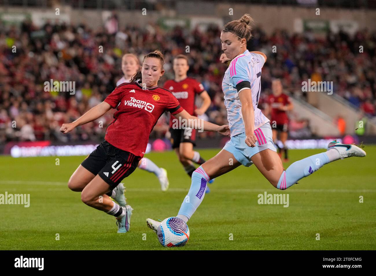 Steph Catley #7 of Arsenal Women crosses the ball under pressure from ...