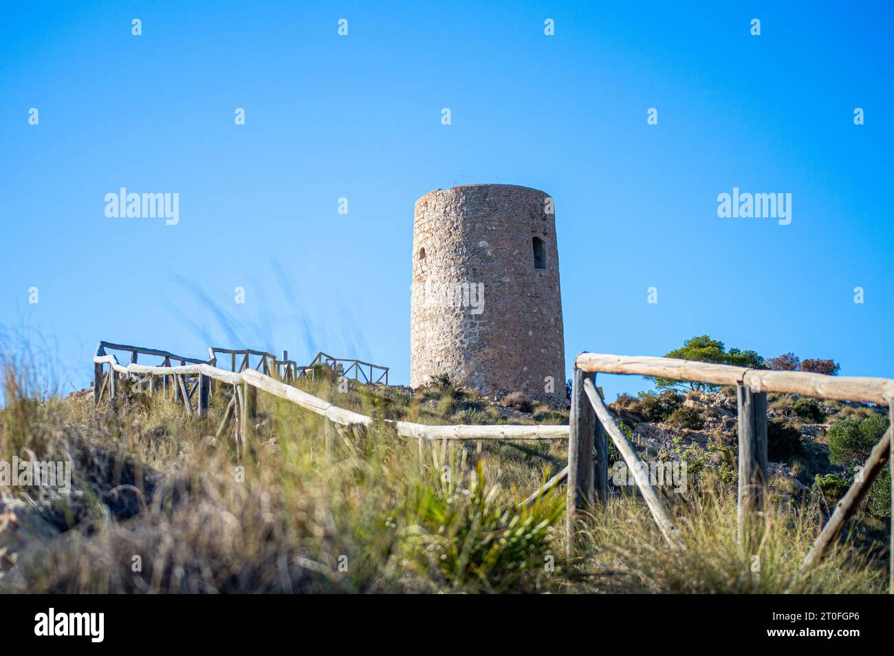 Mediterranean coastal landscape. Historic Torre Vigia De Cerro Gordo, a ...