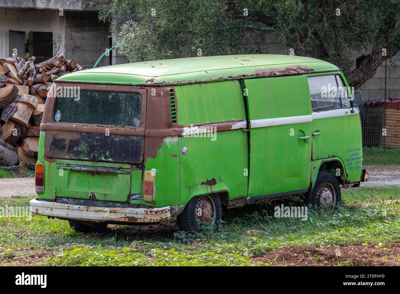 volkswagen camper van rusting away in a garden in greece. abandoned ...
