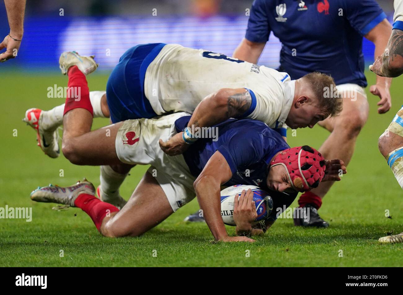 Italy's Lorenzo Cannone tackles France's Louis Bielle Biarrey during ...