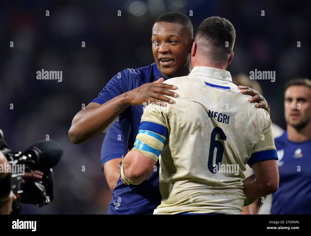 France's Cameron Woki and Italy's Sebastian Negri embrace after the Rugby World Cup 2023, Pool A ...