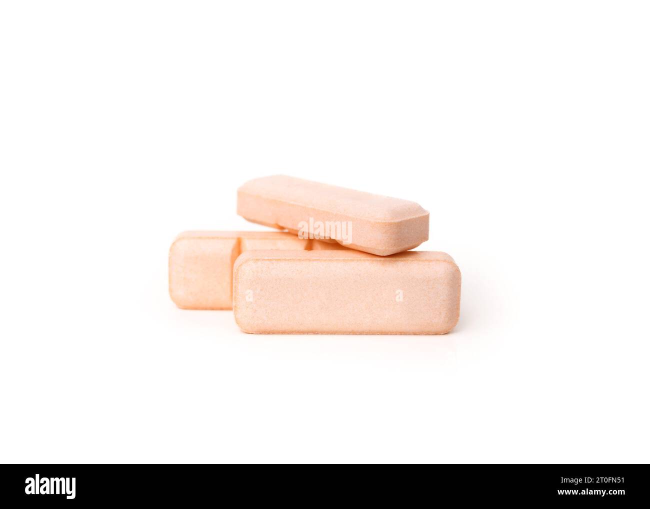 Isolated pile of piles. Multiple rectangular pink tablets. Prescription ...