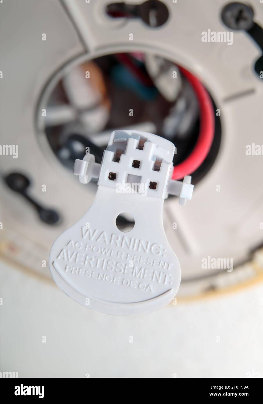 Smoke detector mounting base and plug with wires and warning label ac ...