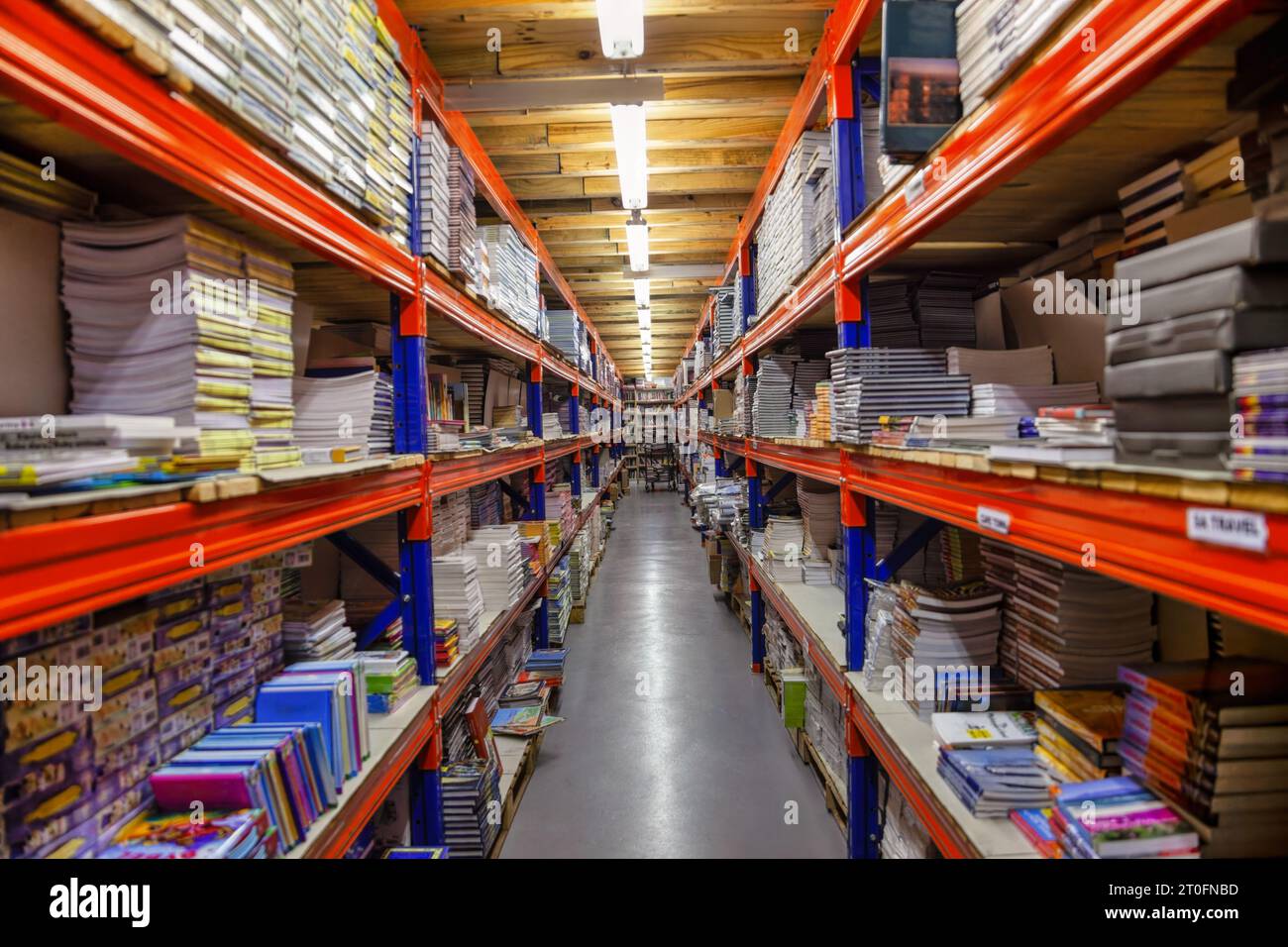heavy duty shelves in a warehouse filled with books and paper rims for ...