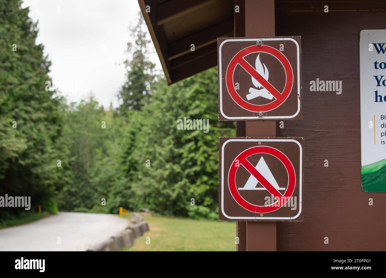 No campfire sign and no camping sign in public park or parking lot ...