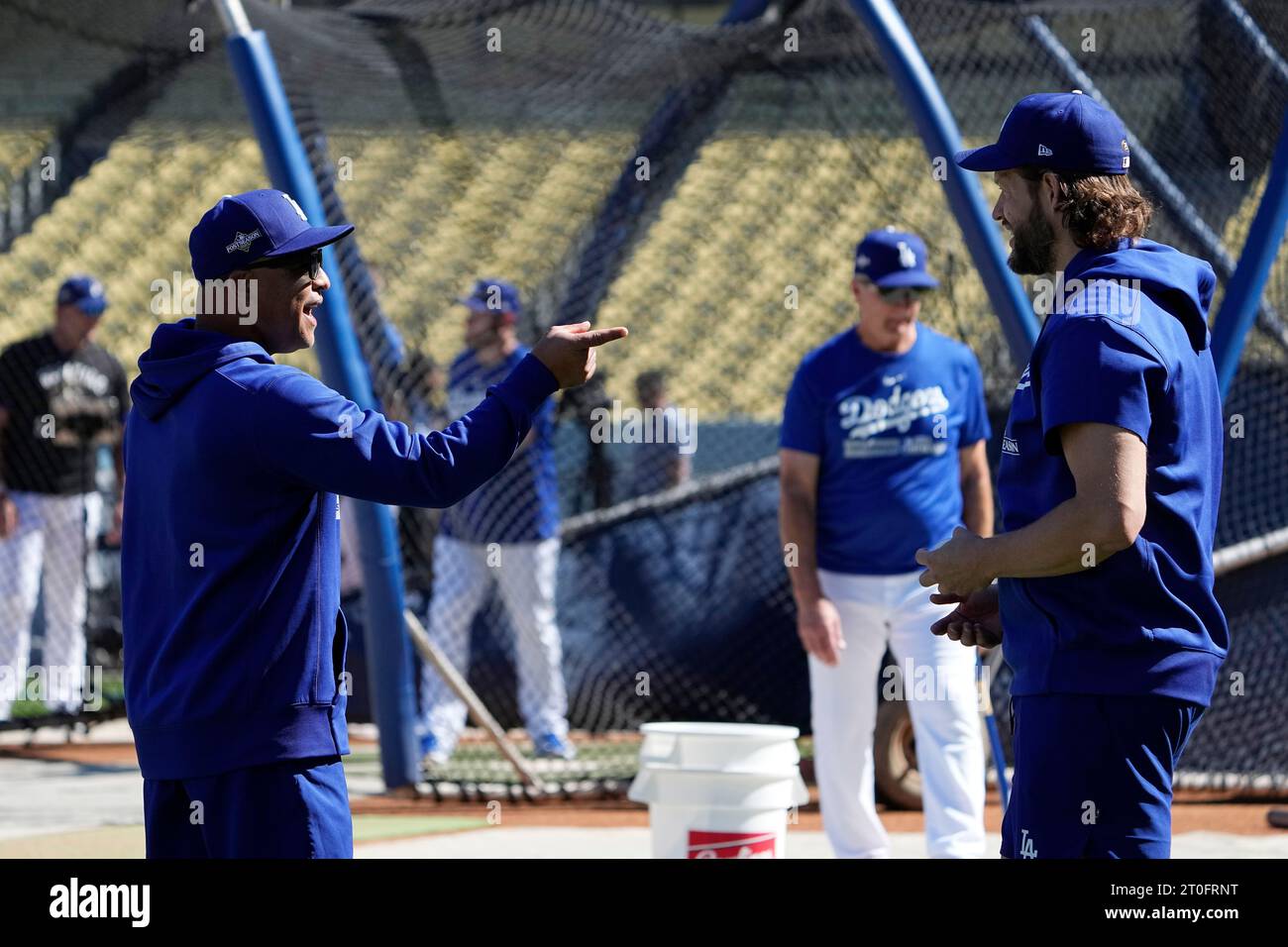 Los Angeles Dodgers manager Dave Roberts, left, talks with starting ...