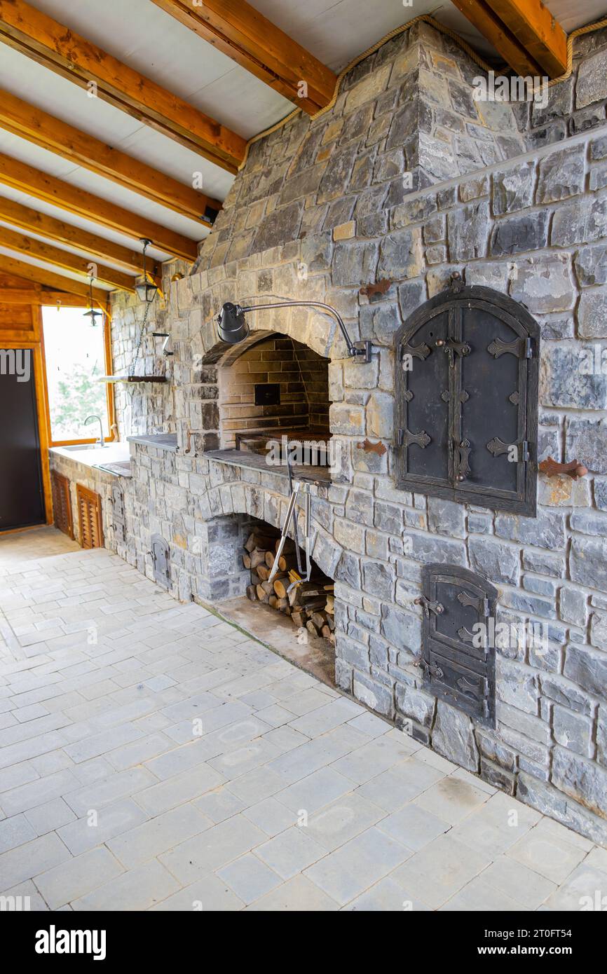 Stone barbecue firewood, open brick oven for cooking kebabs and other ...