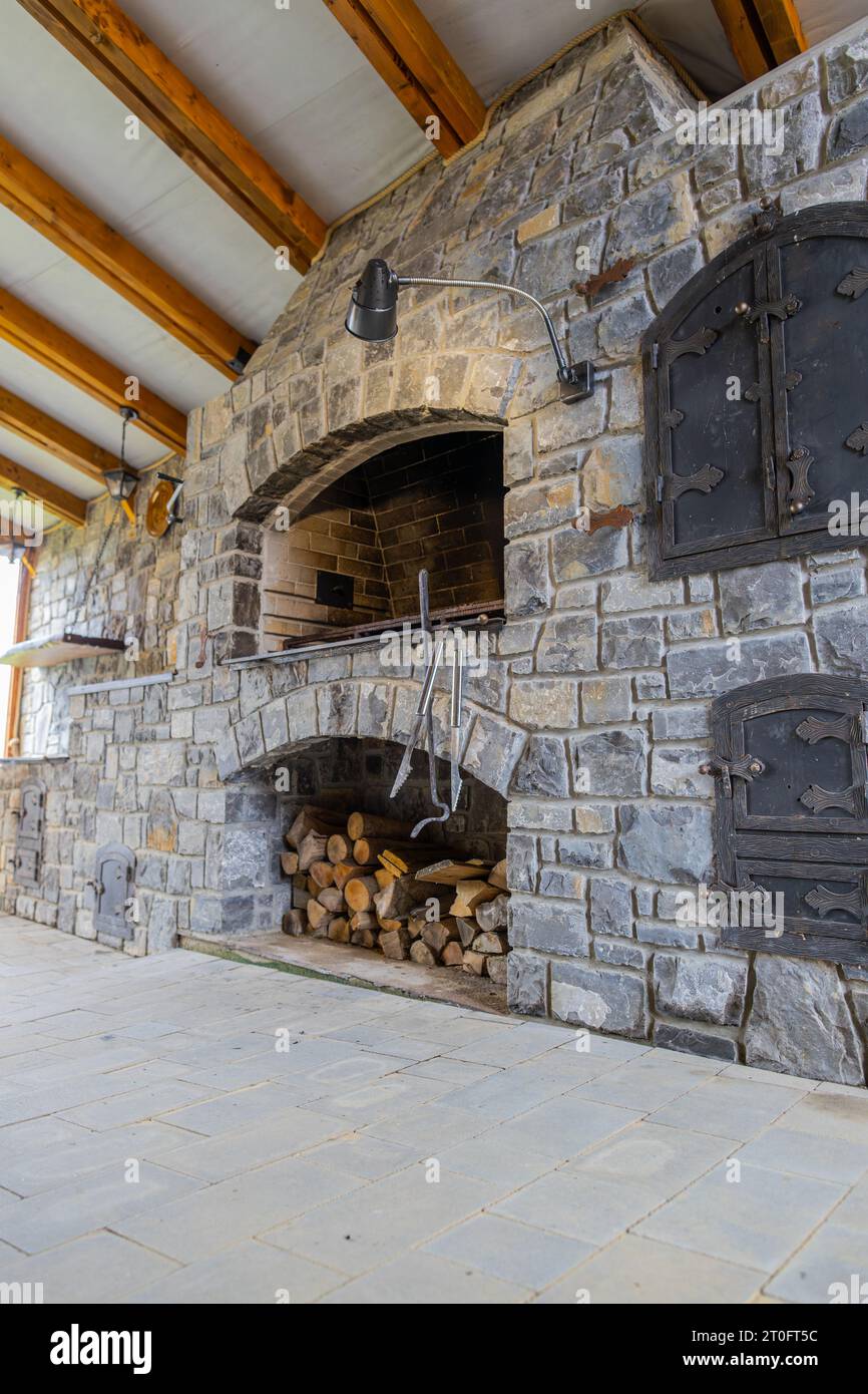 Stone barbecue firewood, open brick oven for cooking kebabs and other ...