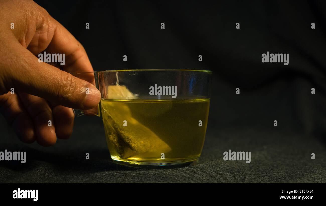 A serene moment captured with a cup of green tea, symbolizing good ...