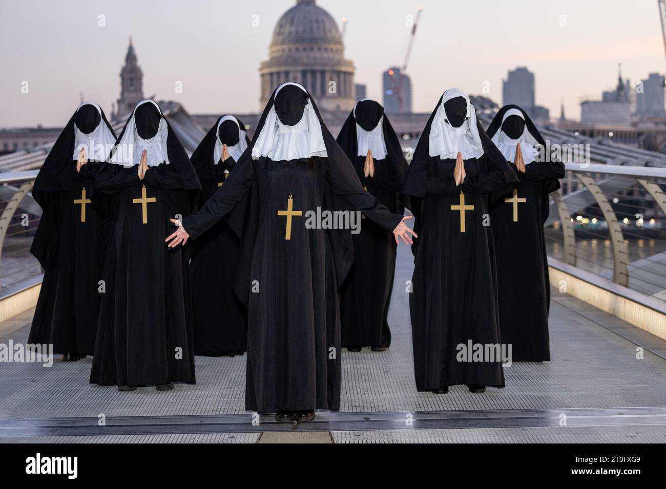Seven demonic nuns descend on London's Millennium Bridge to celebrate ...