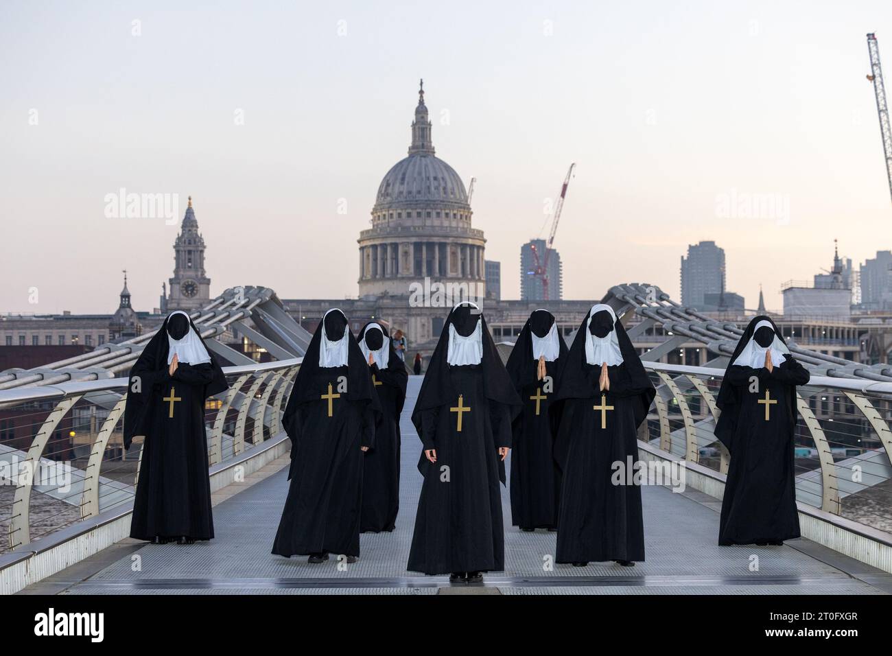 Seven demonic nuns descend on London's Millennium Bridge to celebrate ...