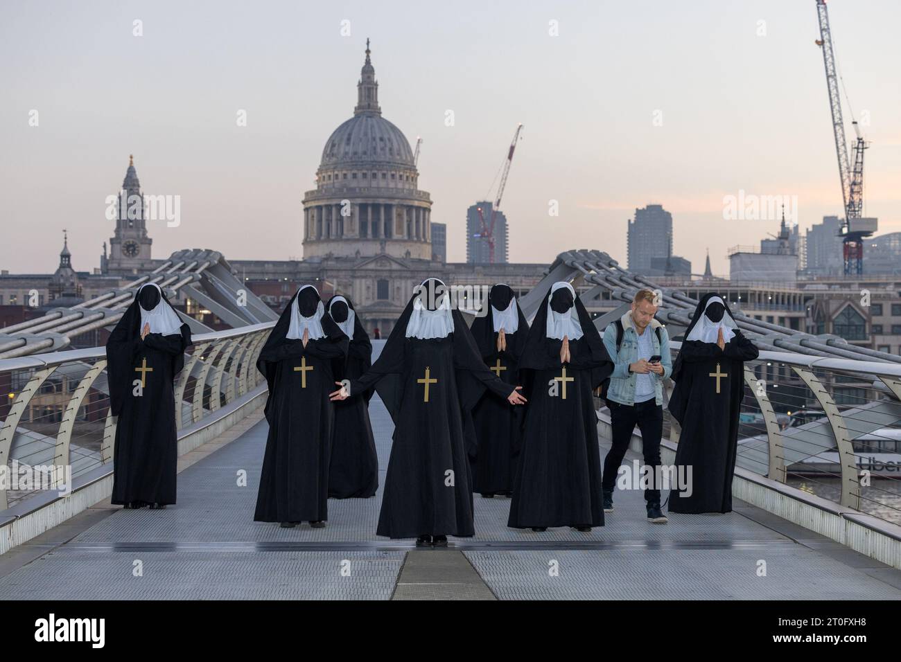 Seven demonic nuns descend on London's Millennium Bridge to celebrate ...