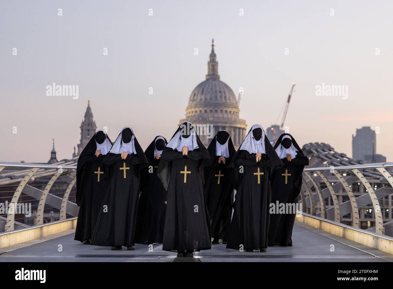 Seven demonic nuns descend on London's Millennium Bridge to celebrate ...