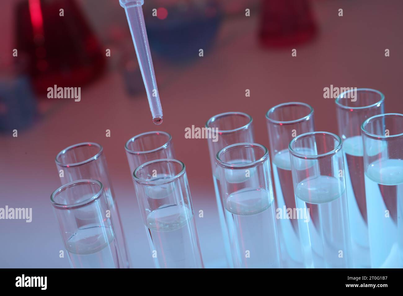 Dripping reagent into test tube, closeup. Laboratory analysis Stock ...