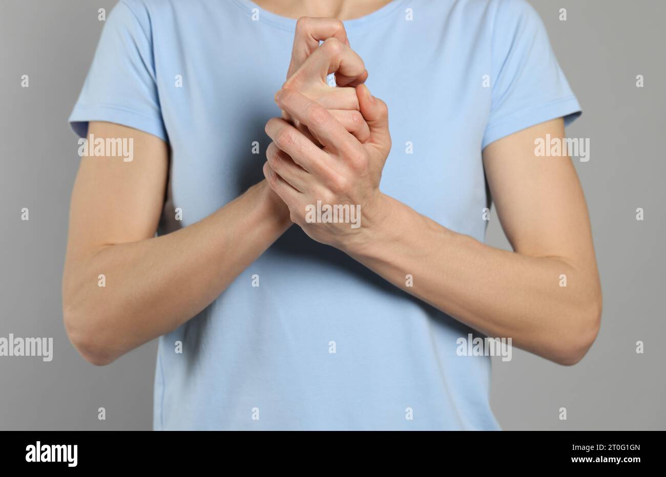 Female cracking knuckles hi-res stock photography and images - Alamy