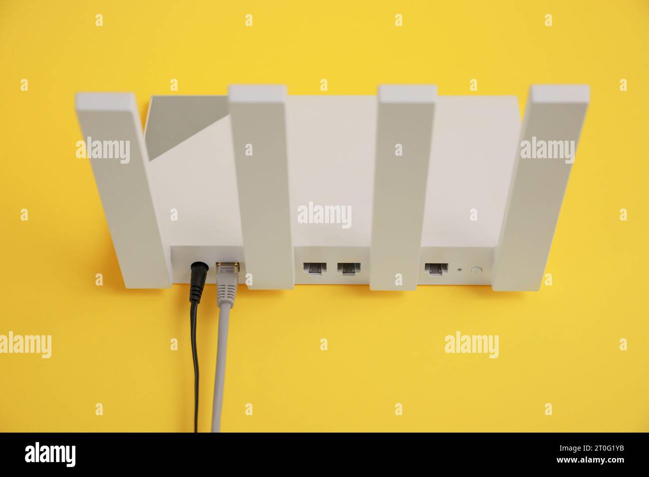 Modern Wi-Fi router on yellow background, above view Stock Photo - Alamy