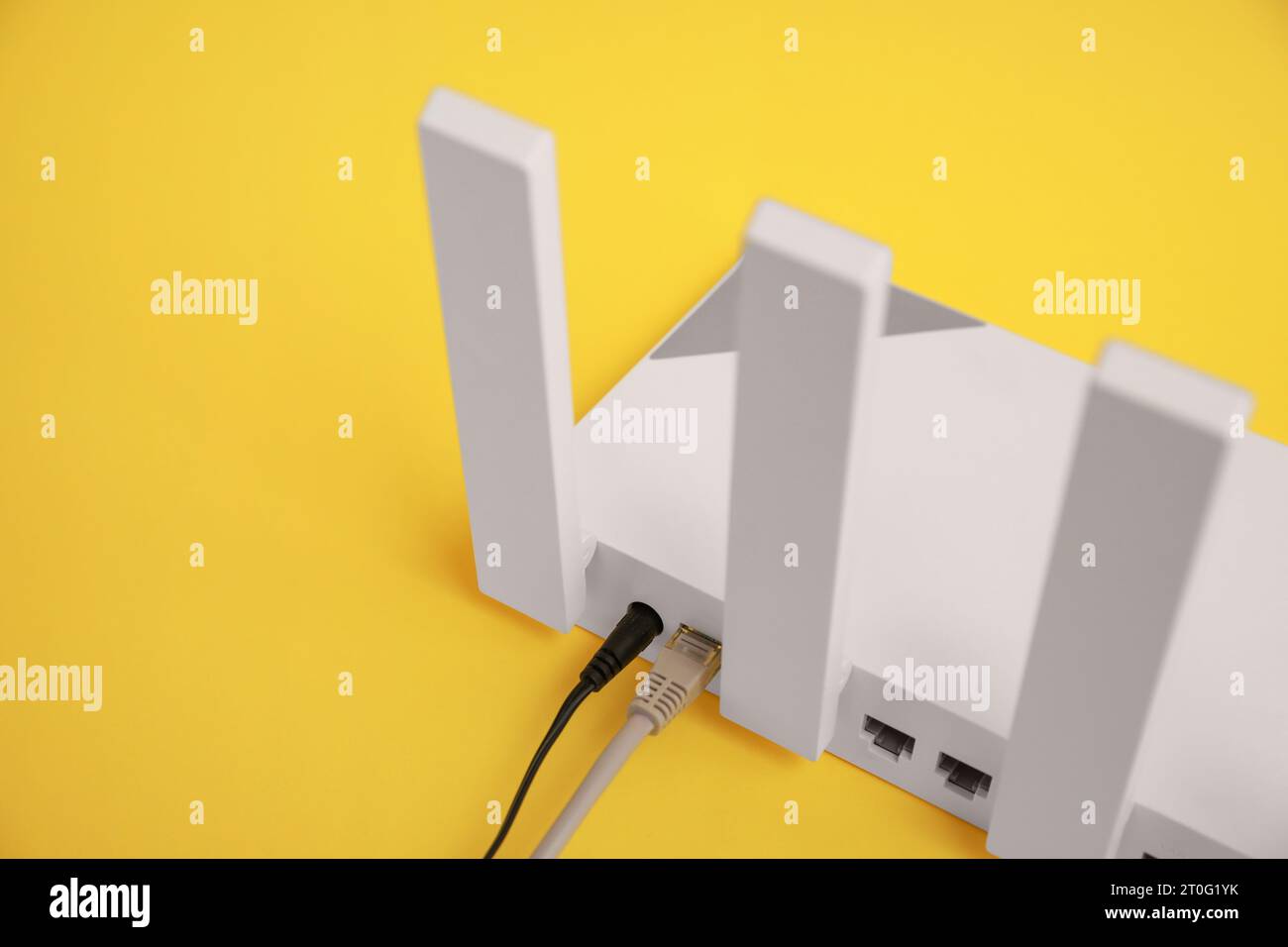 Modern Wi-Fi router on yellow background, closeup Stock Photo - Alamy