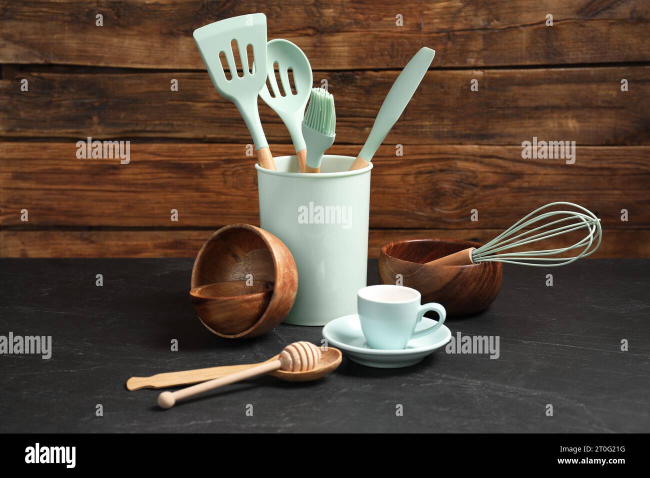Set of different kitchen utensils on grey table Stock Photo - Alamy
