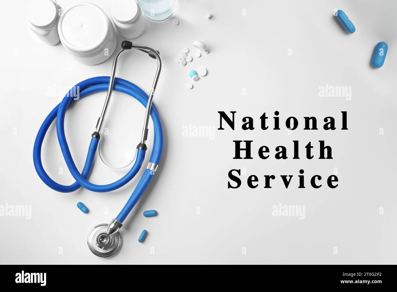 National health service (NHS). Stethoscope, pills and text on white ...