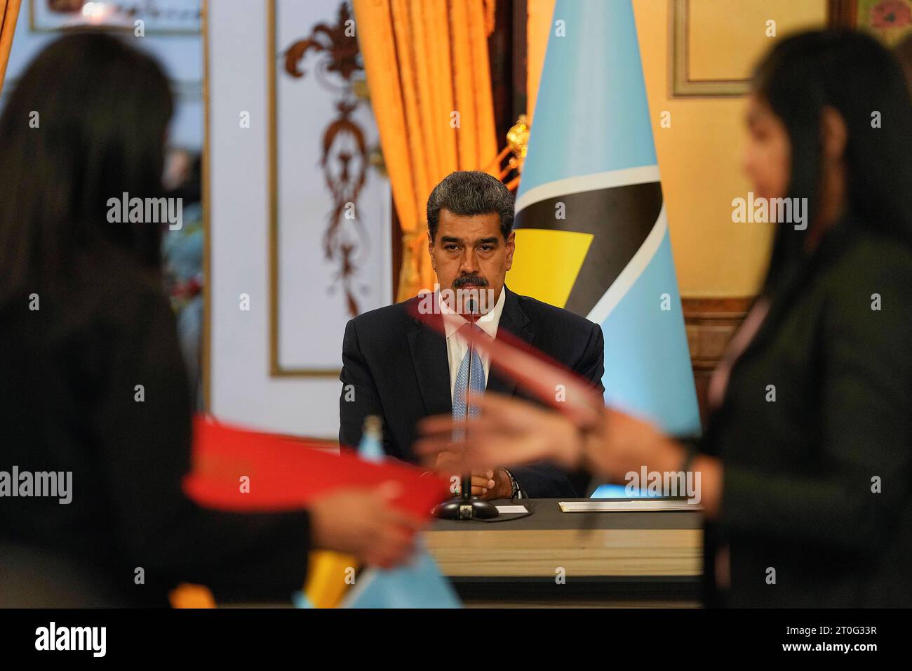 Venezuelan President Nicolas Maduro sits during a meeting with Saint ...