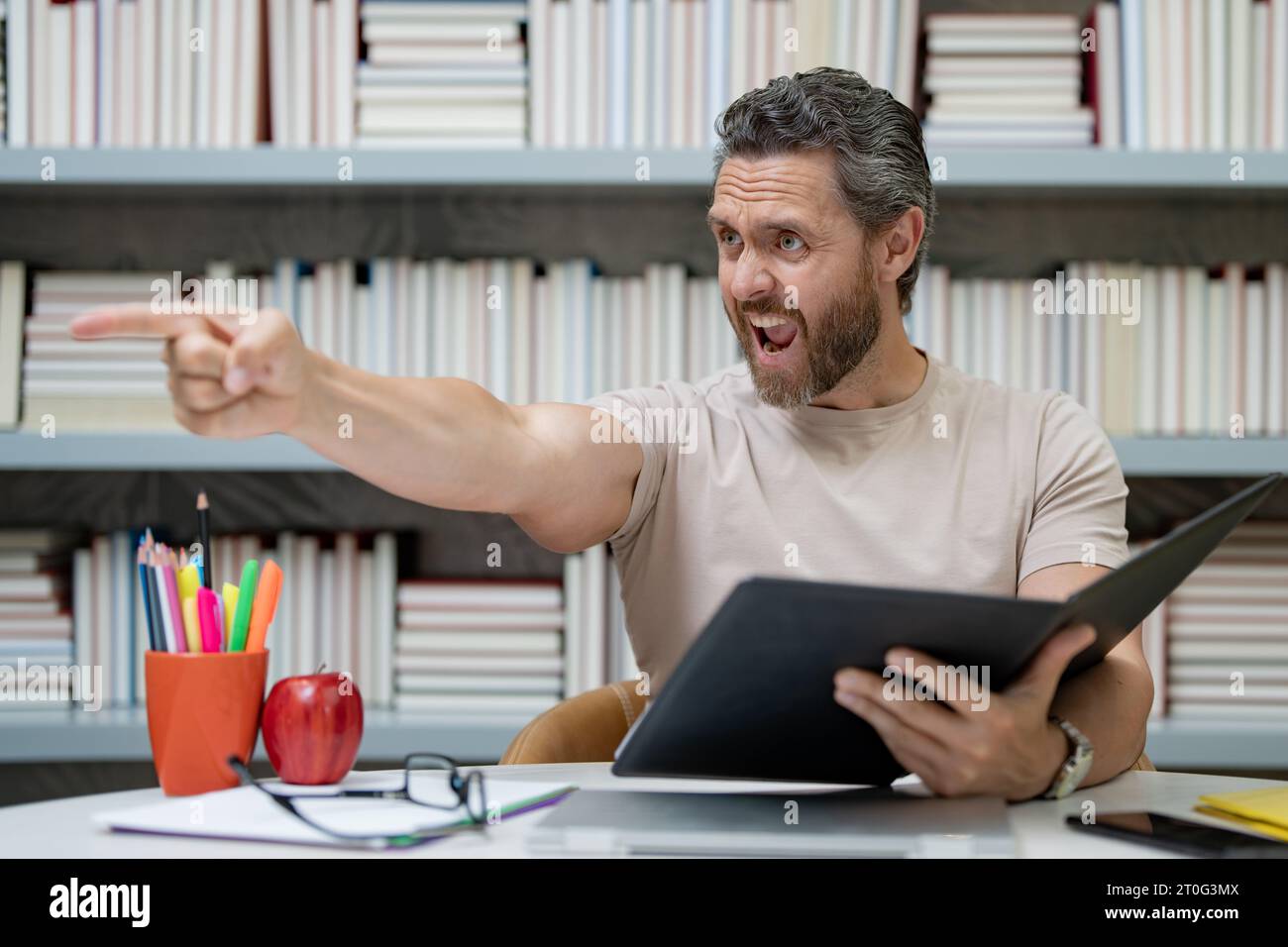 Angry teacher in classroom hi-res stock photography and images - Alamy