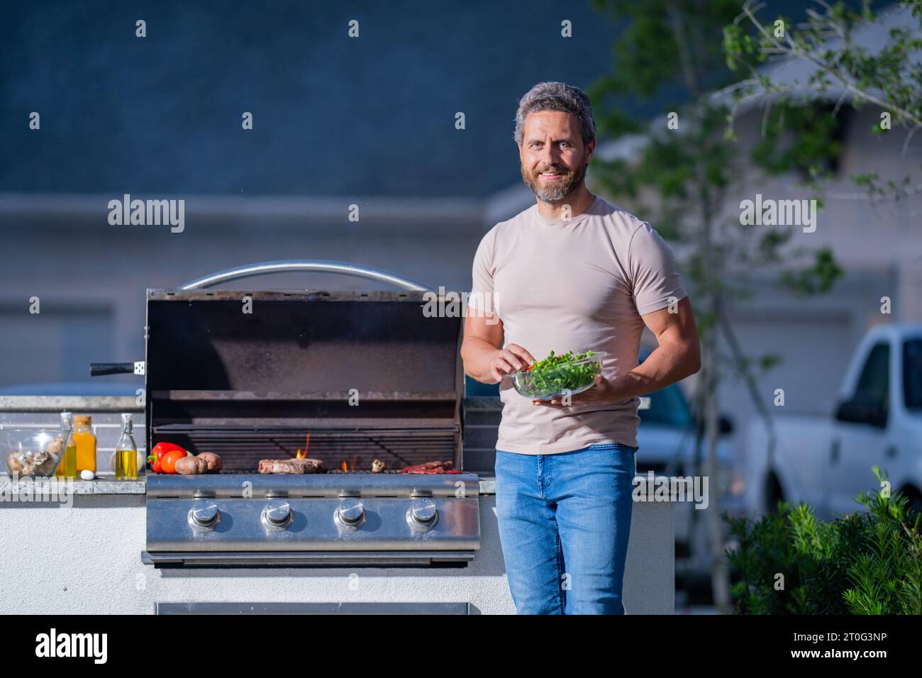 Male chef cooking at a party hi-res stock photography and images - Alamy