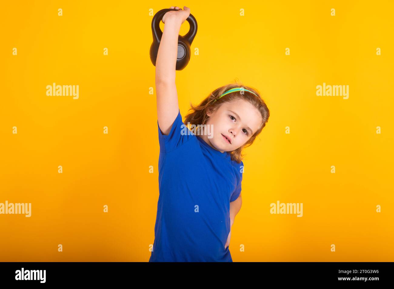 Kid boy working out with dumbbells. Sport and kids training Stock Photo ...