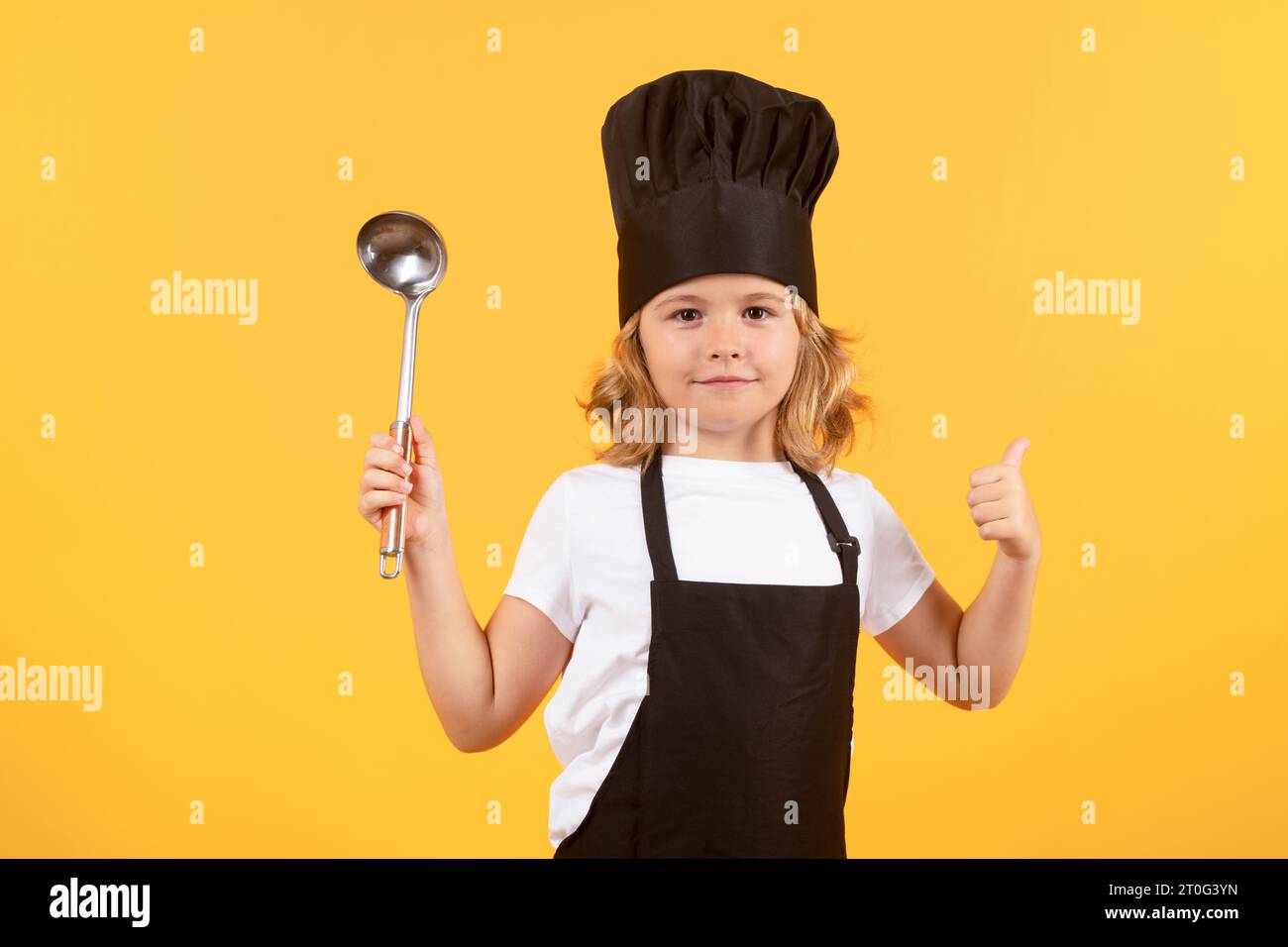 Funny kid chef cook with kitchen ladle, studio portrait. Cooking ...