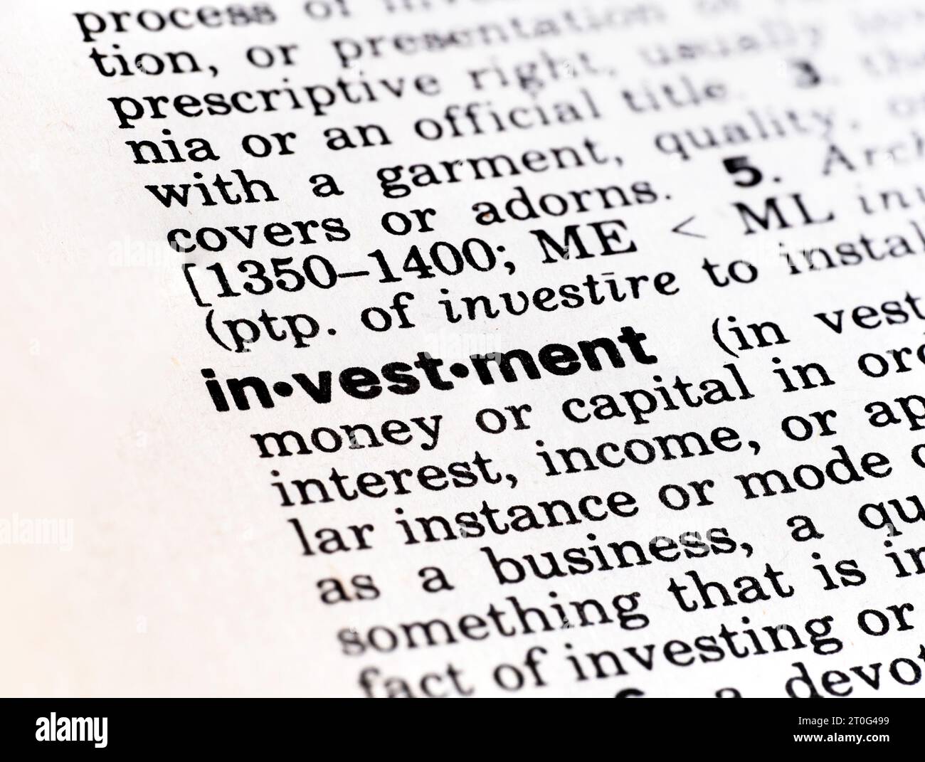 Closeup definition of the word investment Stock Photo - Alamy