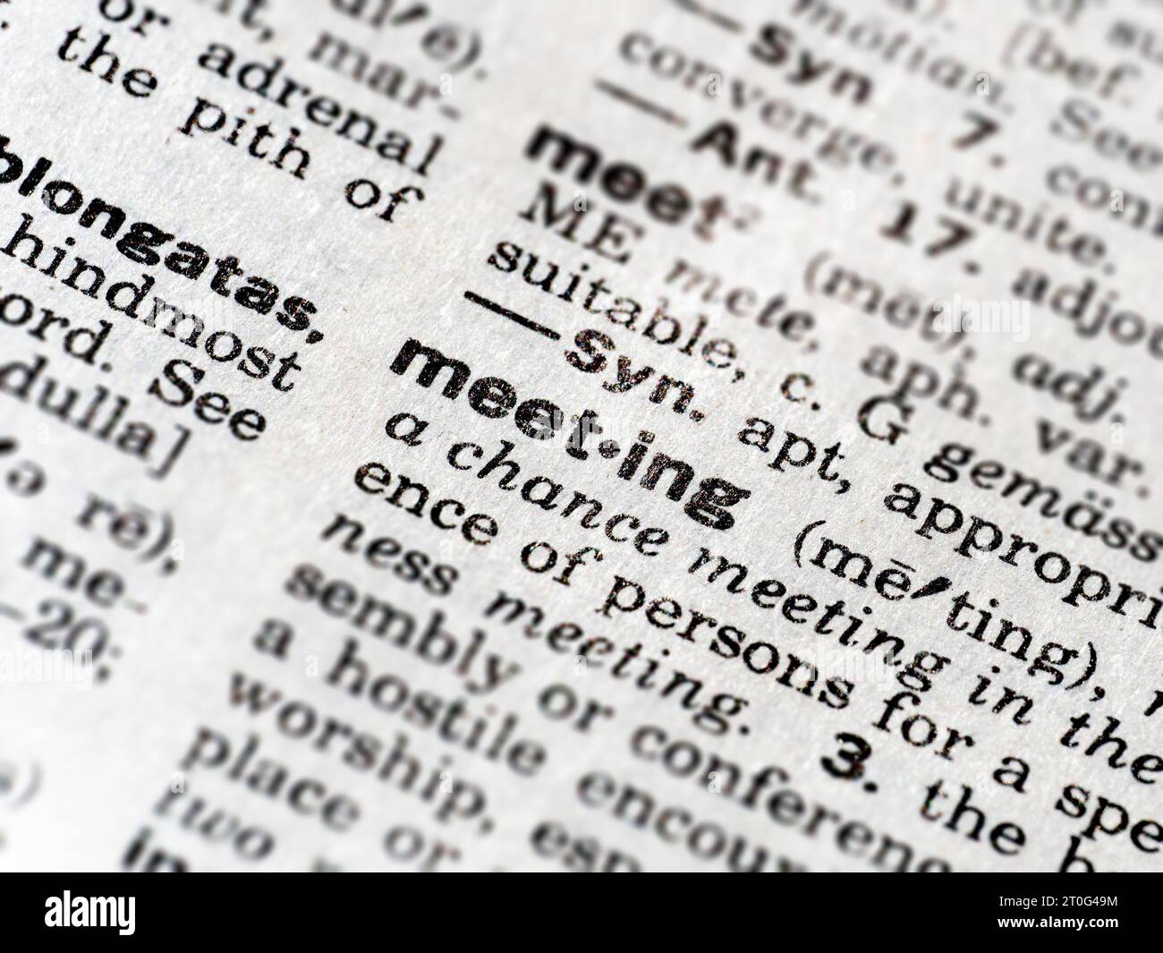 Closeup definition of the word meeting Stock Photo - Alamy